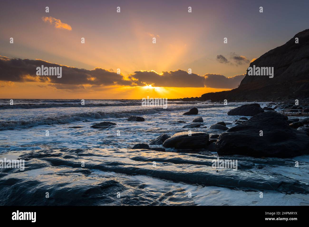 Seatown, Dorset, UK. 22nd February 2022. UK Weather. Beams of sunlight ...
