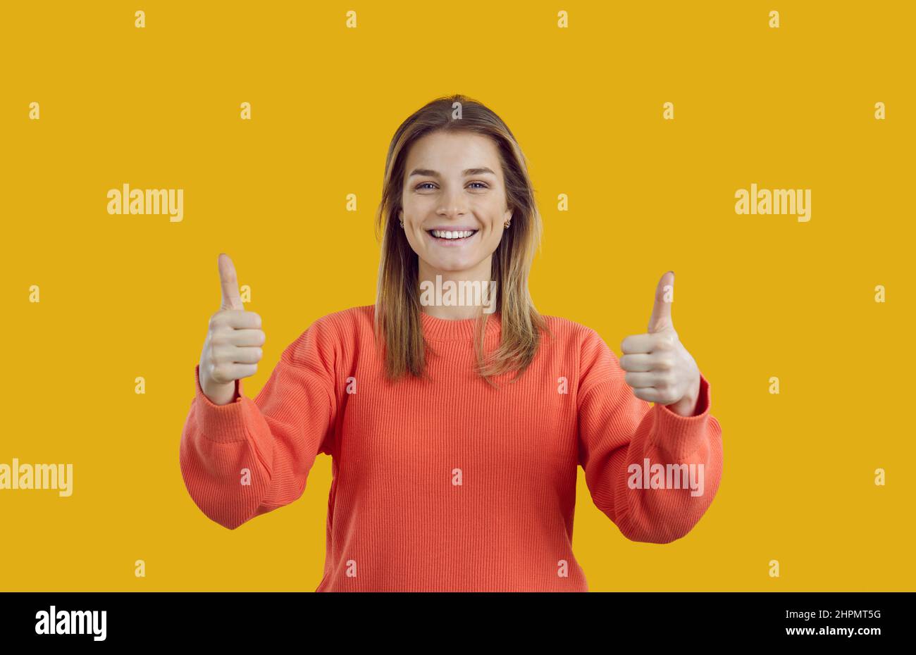 Smiling girl show thumbs up recommend service Stock Photo - Alamy