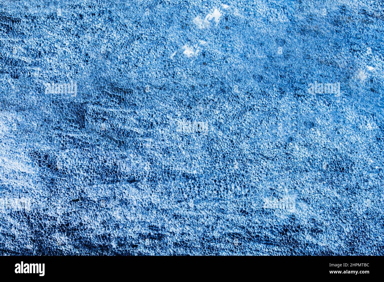 Photo of light blue toned frozen small ice crystals surface texture ...