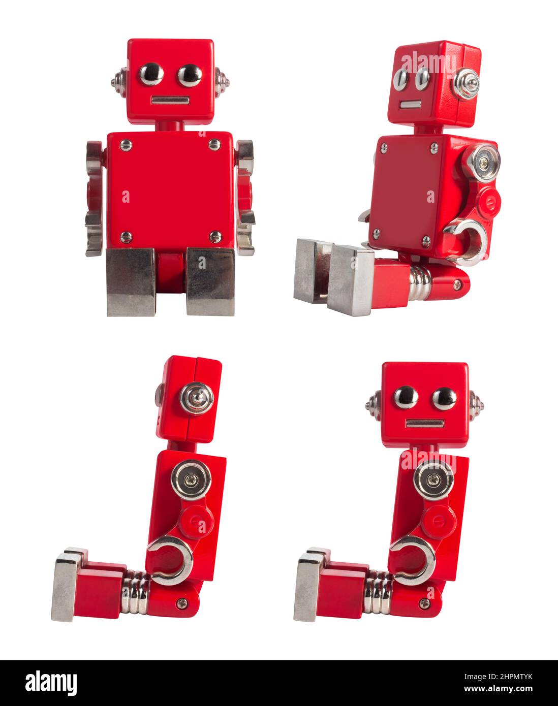 Isolated photo of red colored metal miniature robot toy sitting on ...