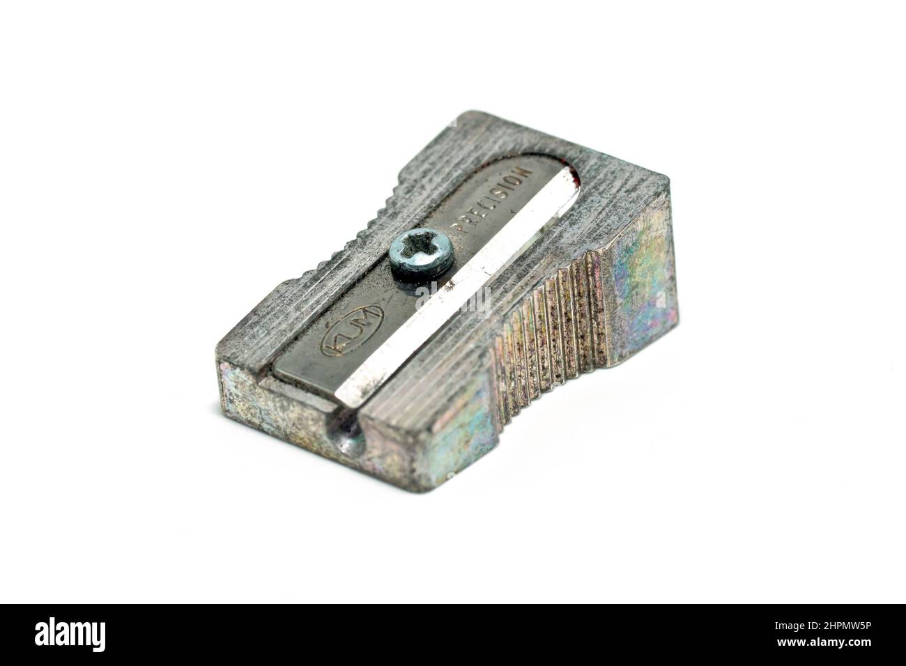 Close up of a well used single hole metal pencil sharpener, branded Kum ...