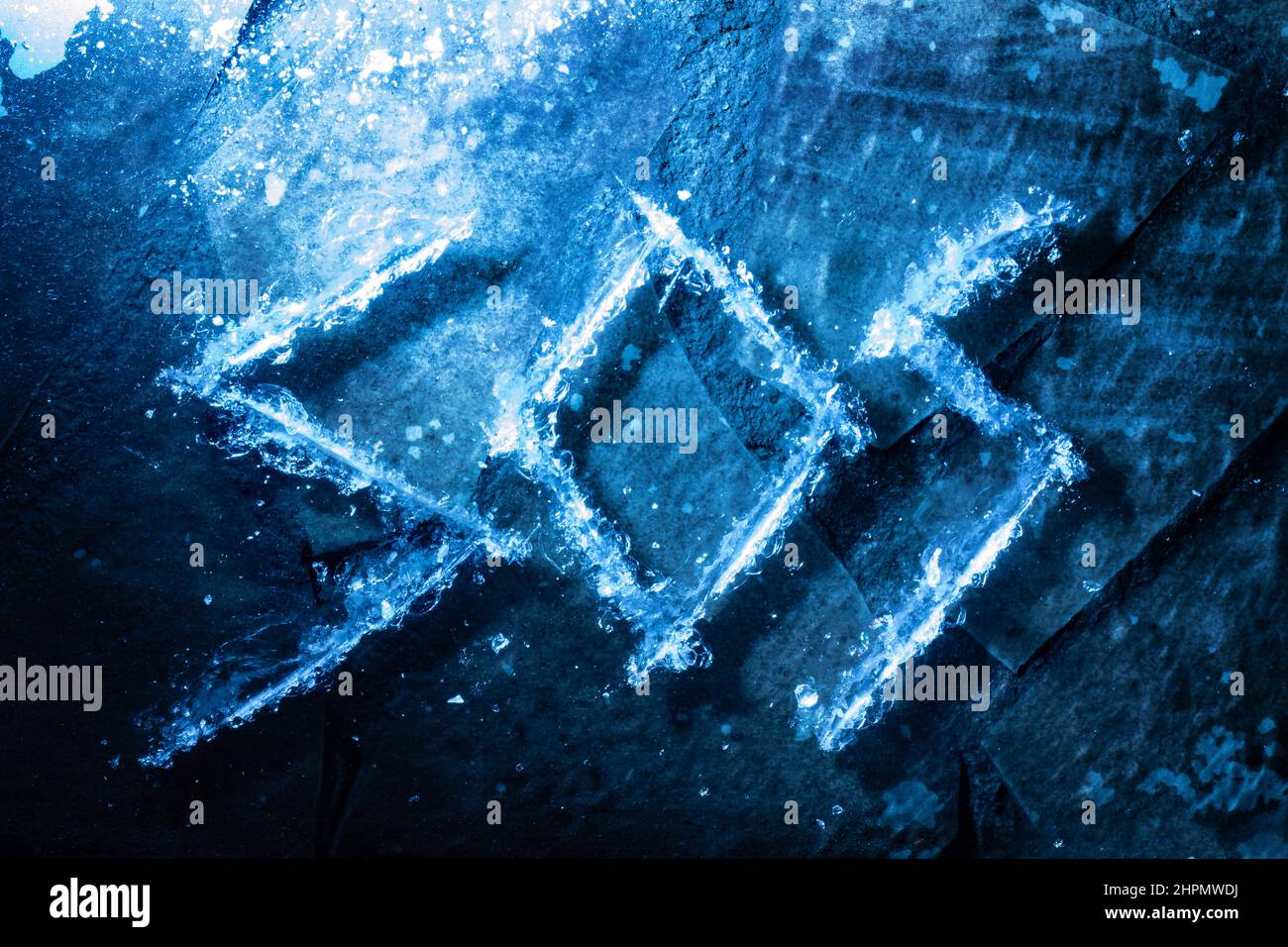 Photo of sos word, meaning save our souls, scratched on cracked ice ...