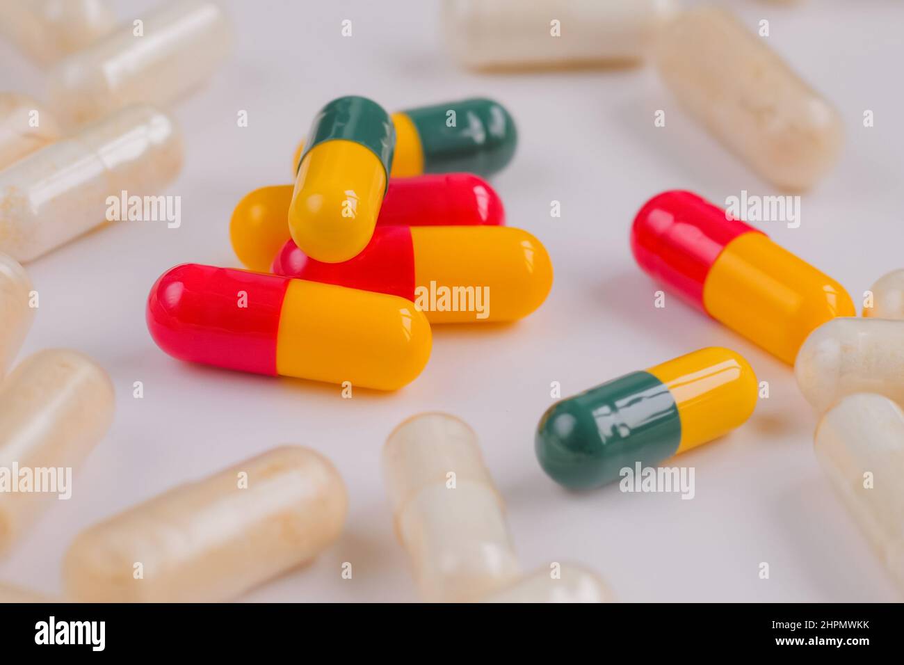 Pills, tablets, drugs, meds, medications on white surface - close up ...