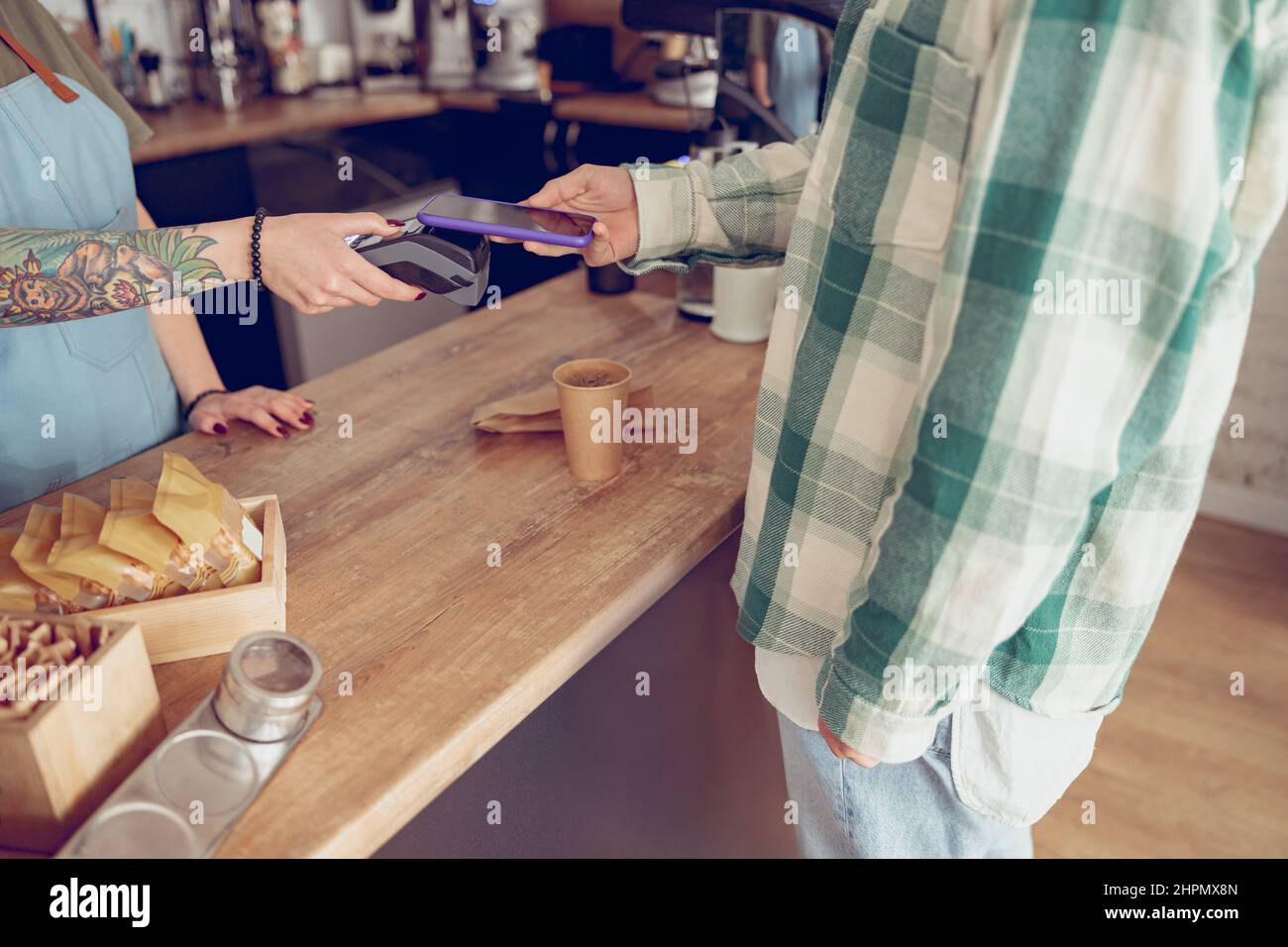 Woman paying money worker hi-res stock photography and images - Alamy