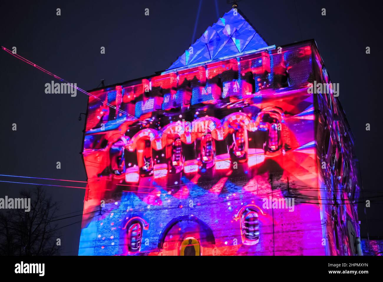 Colorful video mapping show projected on wall of historical building on ...