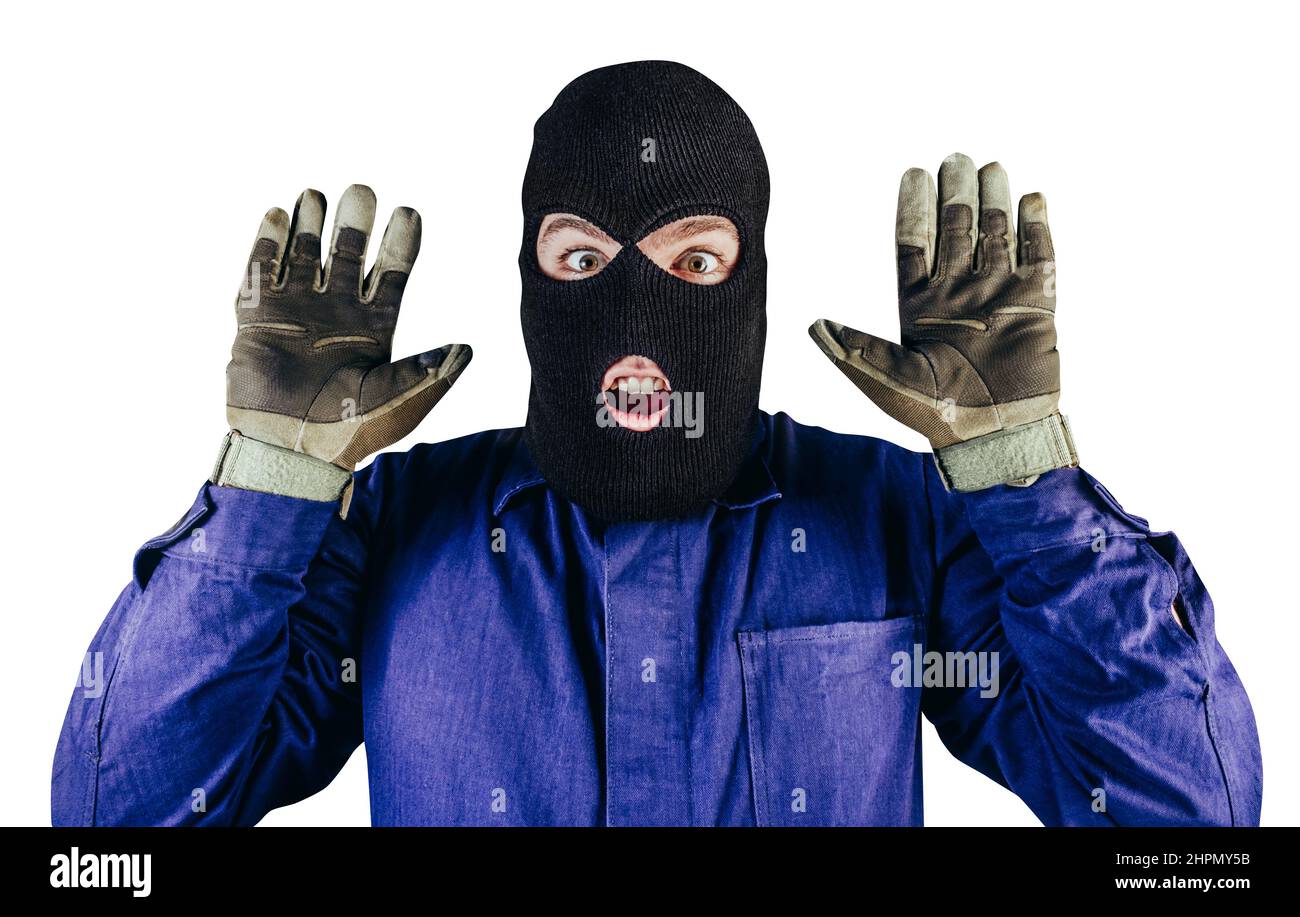 Isolated photo of robber in mask, overalls, gloves putting hands up on ...