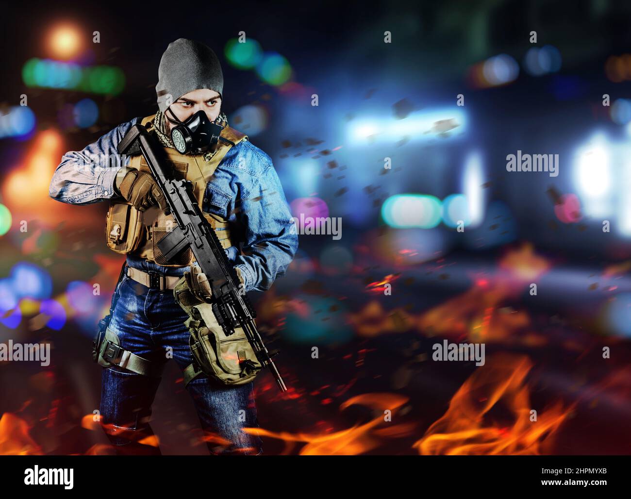 Photo of urban soldier in tactical military outfit and gas mask ...