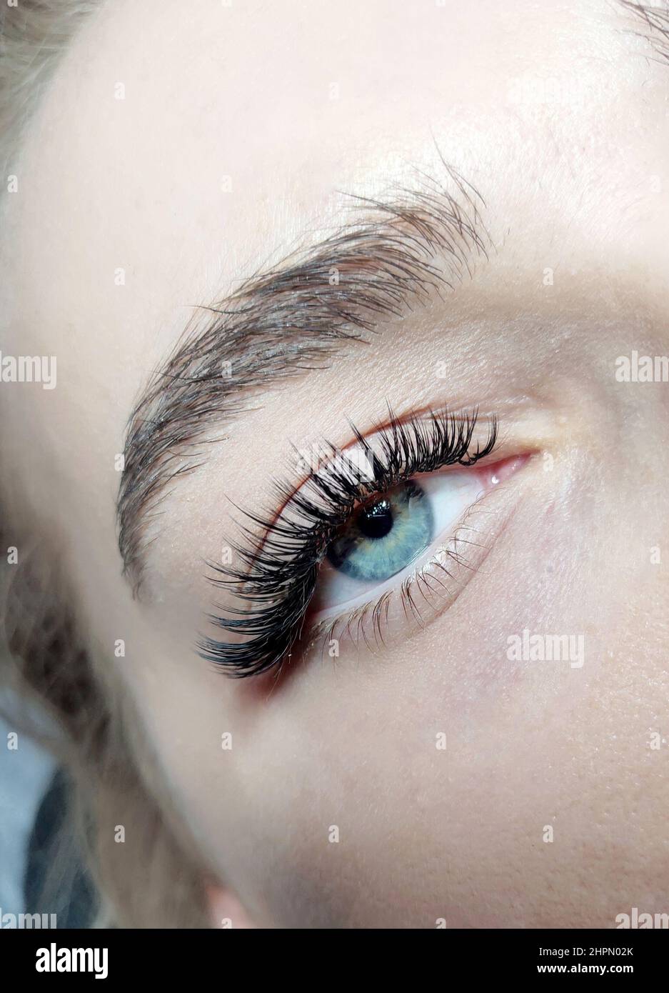 Lash extensions in beauty salon macro eye top view Stock Photo - Alamy