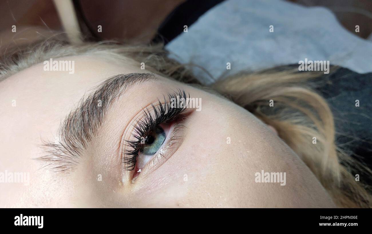Lash extensions in beauty salon macro eye top view Stock Photo - Alamy