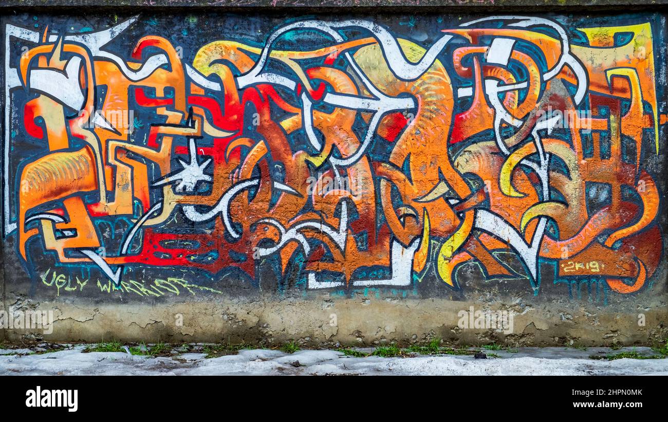 Abstract modern street art. A bright drawing in the courtyard of a ...