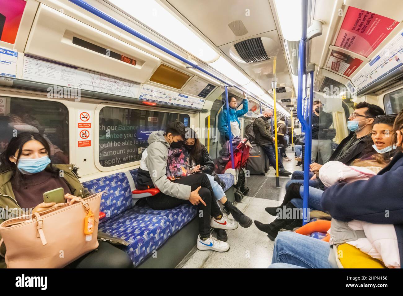 England, London, Subway Passengers Wearing Surgical Masks Stock Photo ...