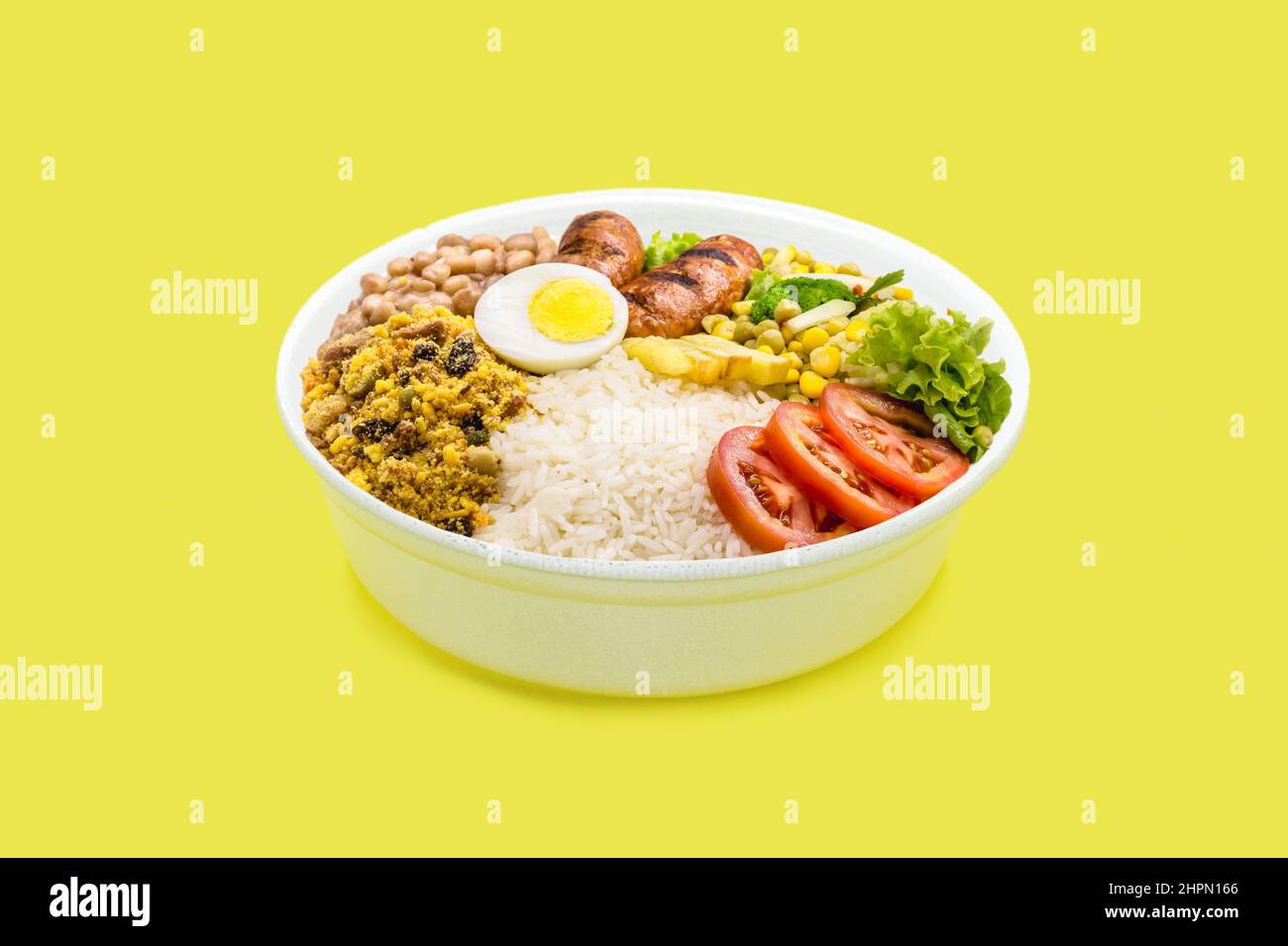 Brazilian lunch box, rice, beans, meat, salad and chips, typical home ...