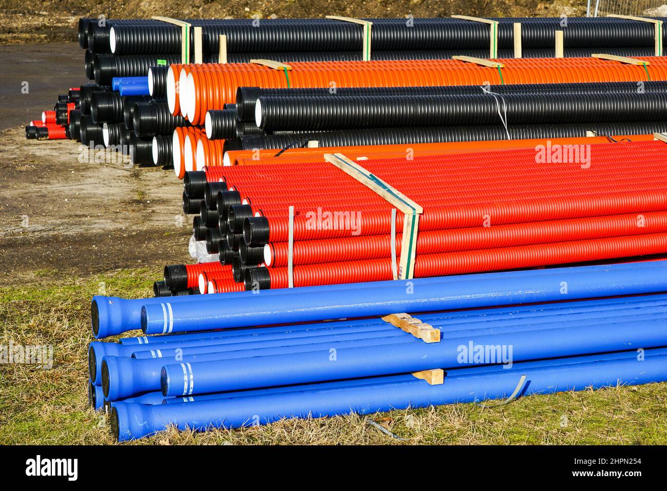 underground communication plastic pipes of various colors and diameters ...