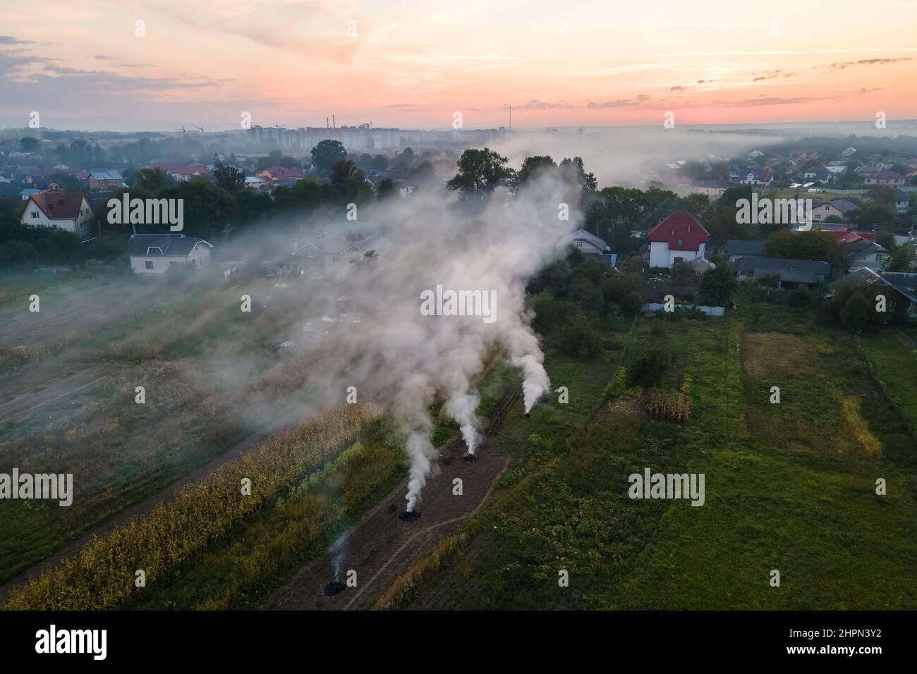 Aerial view of agricultural waste bonfires from dry grass and straw ...