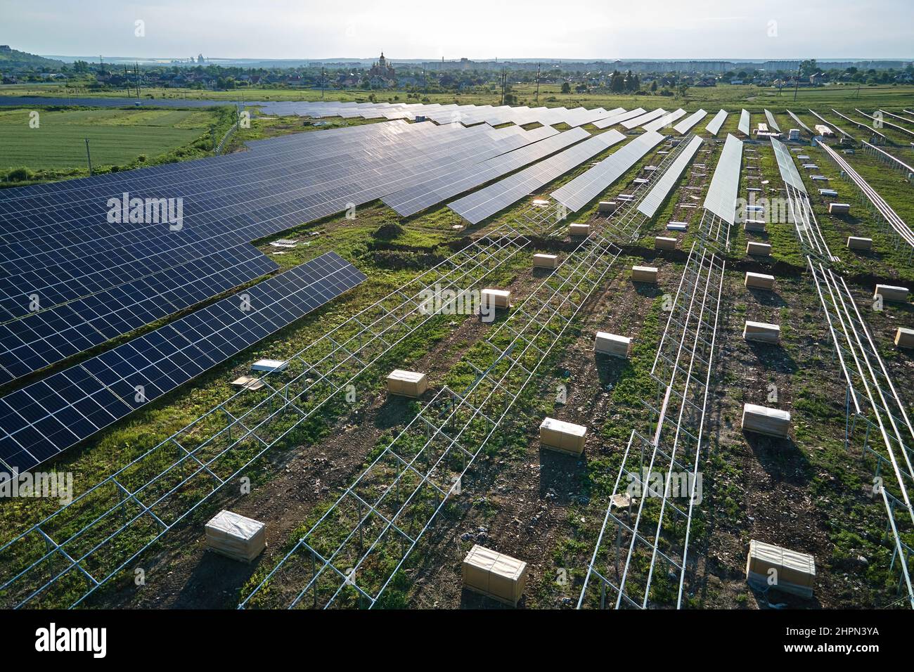 Aerial view of big electric power plant under construction with many ...