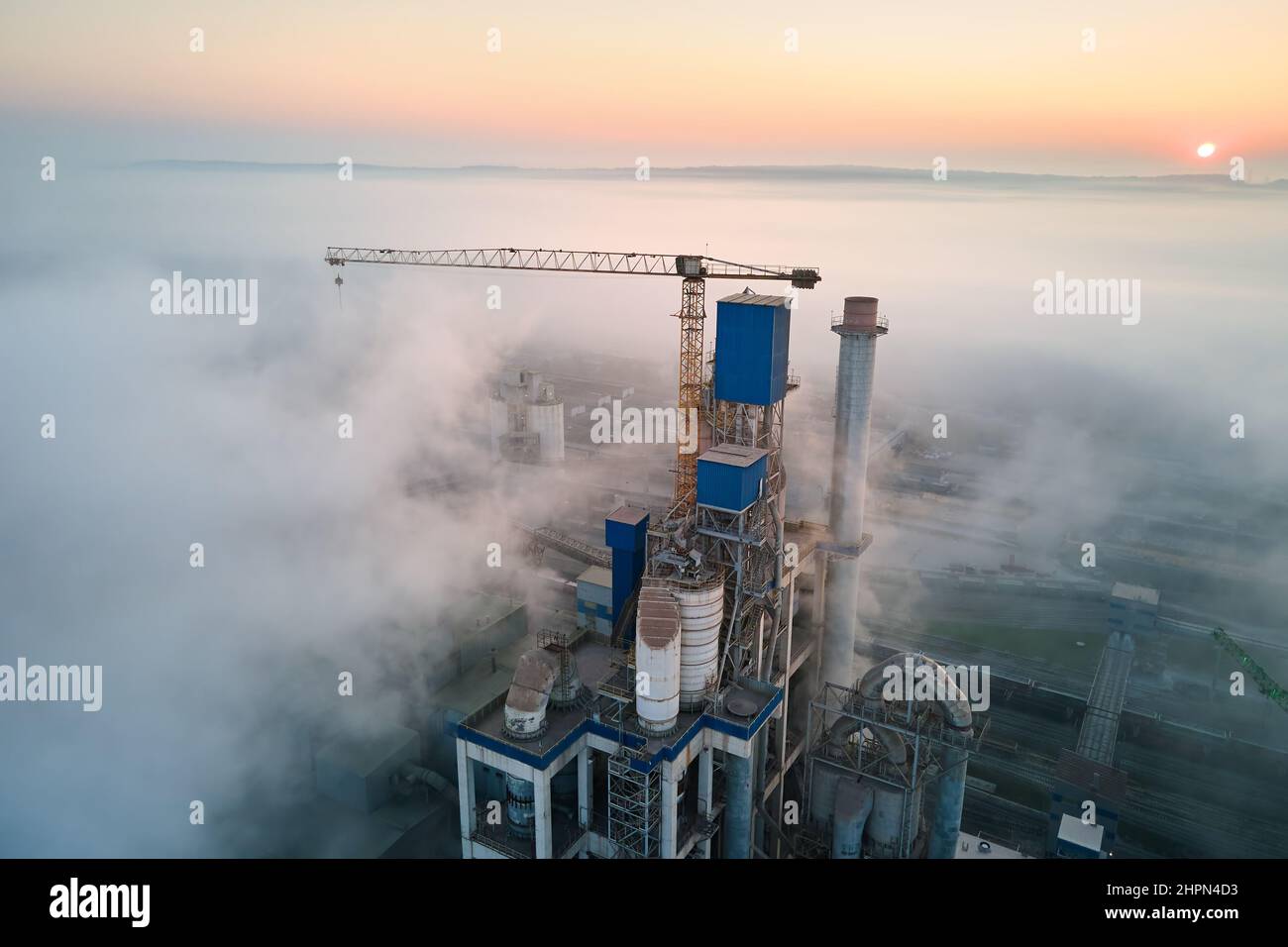 Aerial view of cement factory with high concrete plant structure and ...