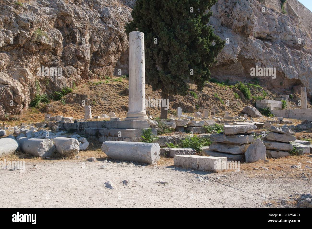 Ancient Greek column and ruins at foot of acropolis in Athens, Greece ...