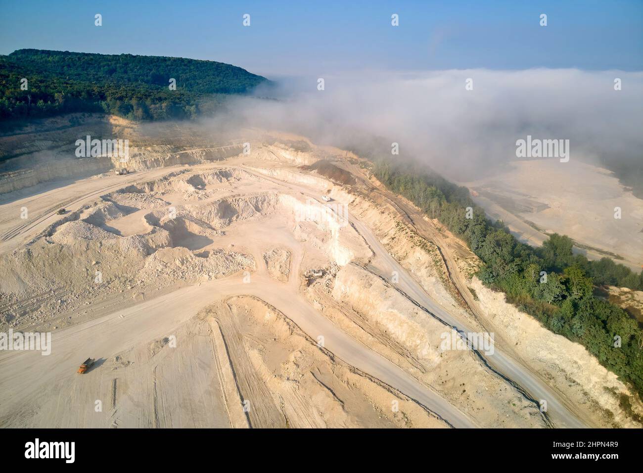Aerial view of open pit mining of limestone materials for construction ...