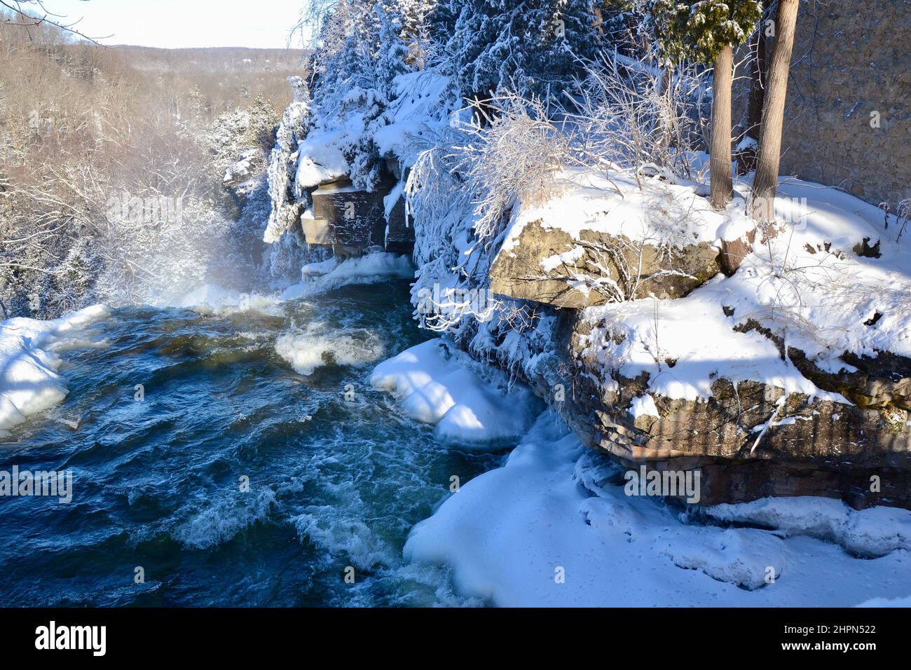 River flowing over limestone cliff at the top of Inglis Falls during ...