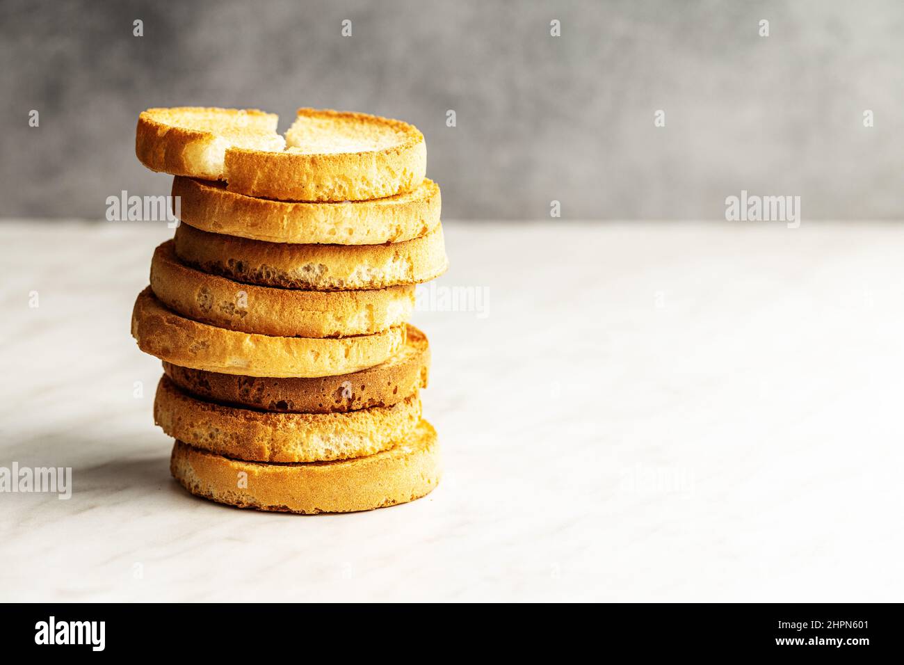 Dietary rusks bread. Crusty biscuits on kitchen table Stock Photo - Alamy