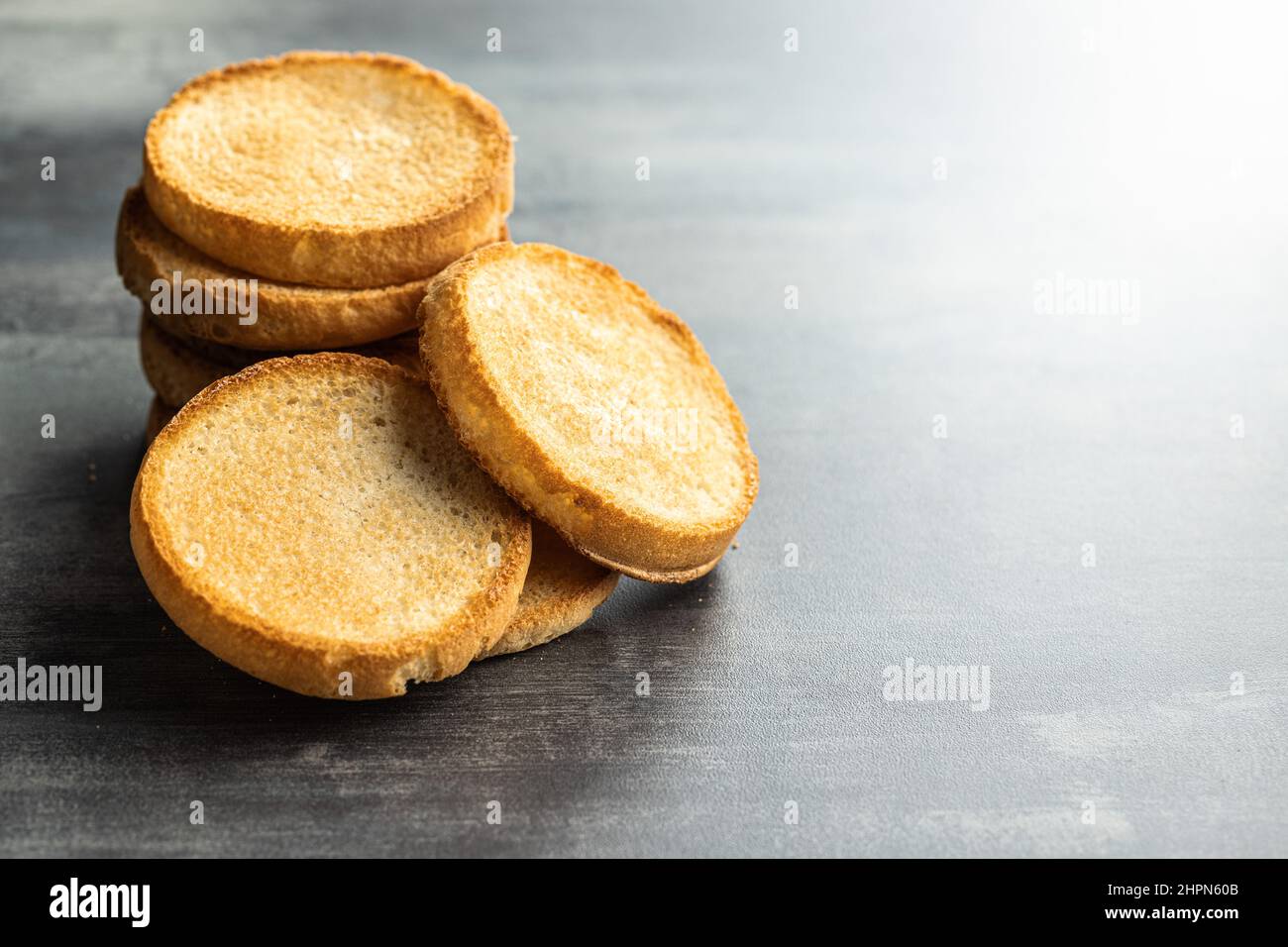 Dietary rusks bread. Crusty biscuits on kitchen table Stock Photo - Alamy