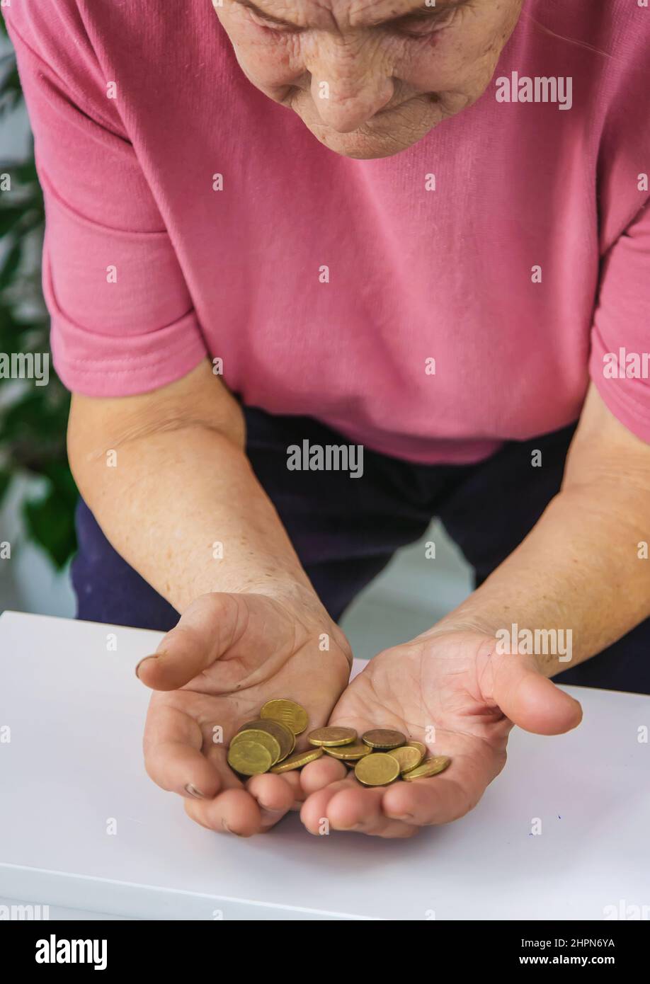 An old woman counts small money. Selective focus Stock Photo - Alamy