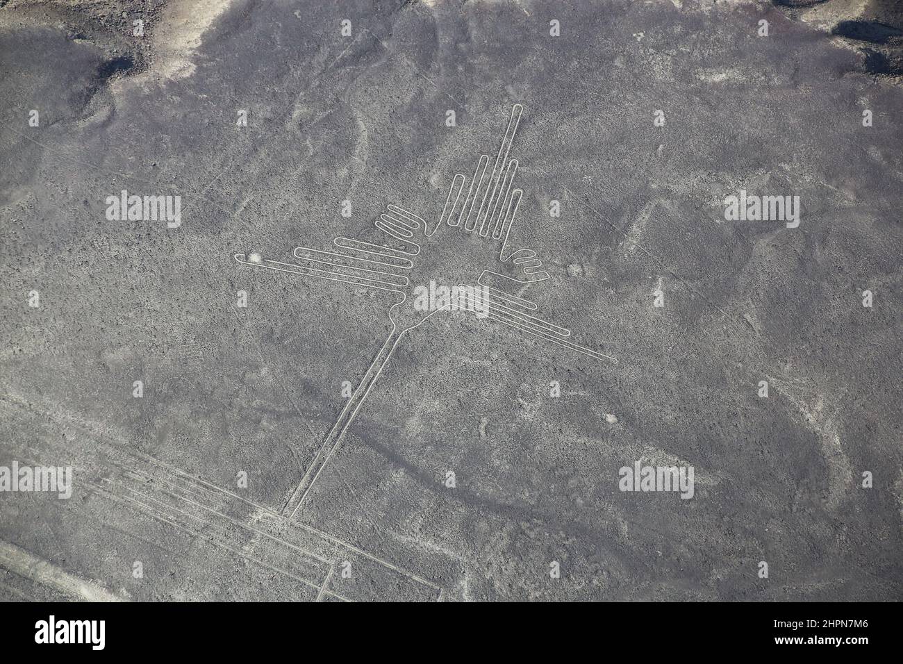 Aerial view of Nazca Lines - Hummingbird geoglyph, Peru. The Lines were ...