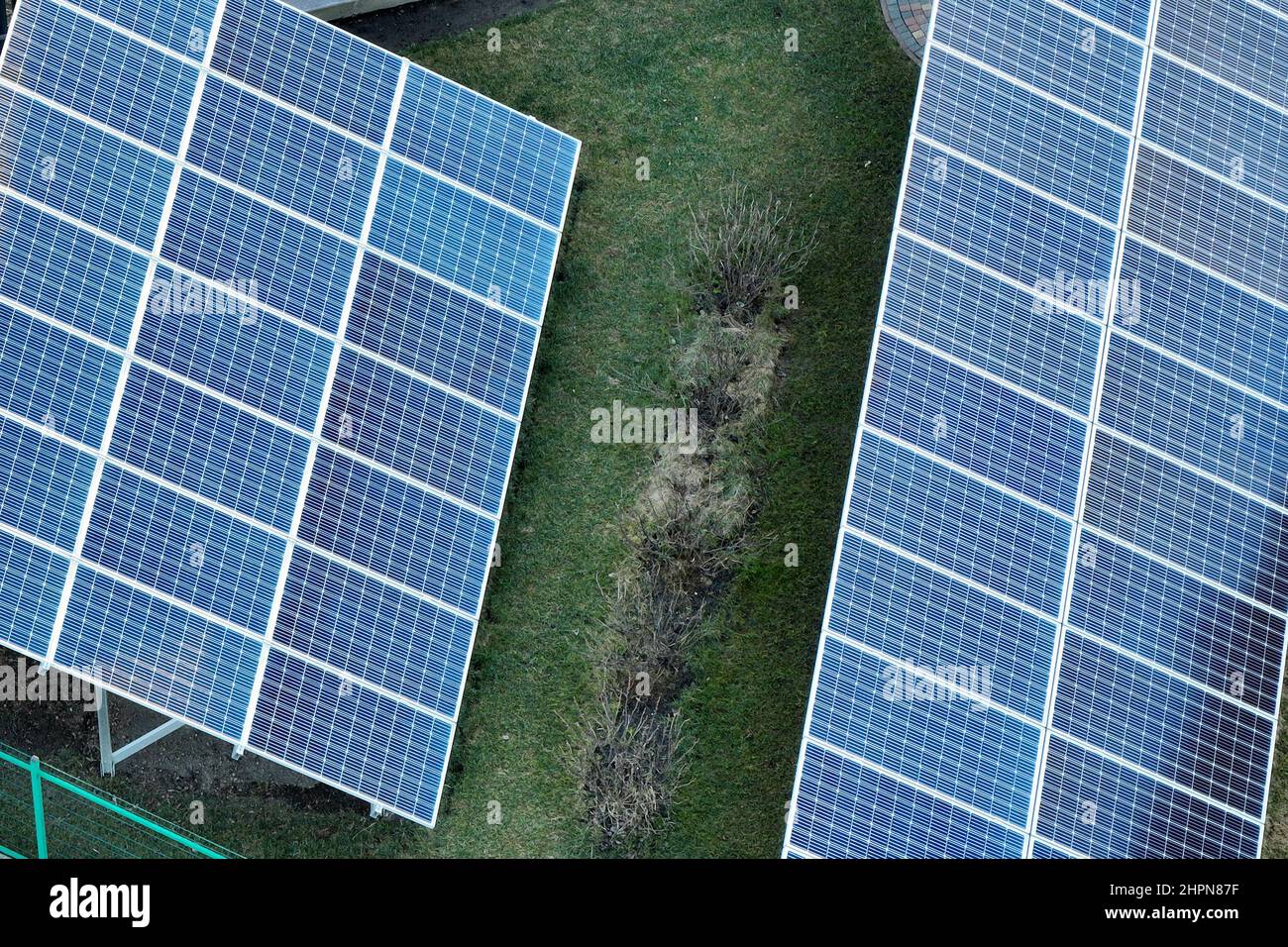 Solar photovoltaic panels mounted on stand-alone frame on backyard ...