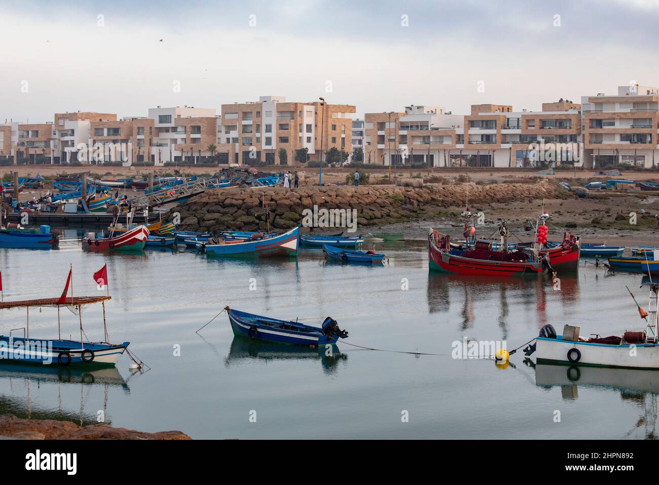 Contemporary residential buildings stand along the banks of the Bou ...