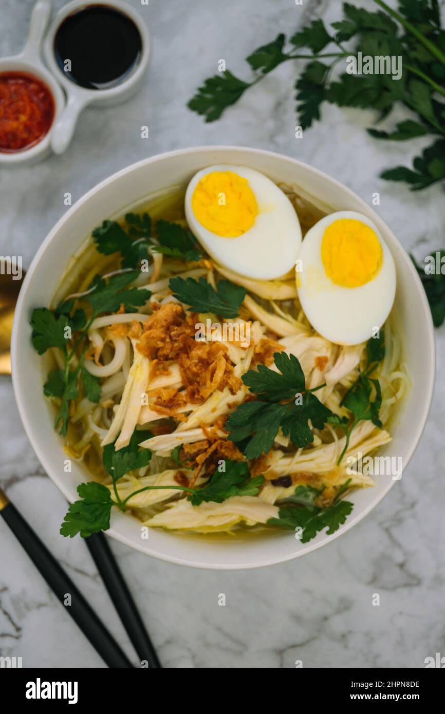 Soto is a traditional Indonesian soup mainly composed of broth, chicken ...