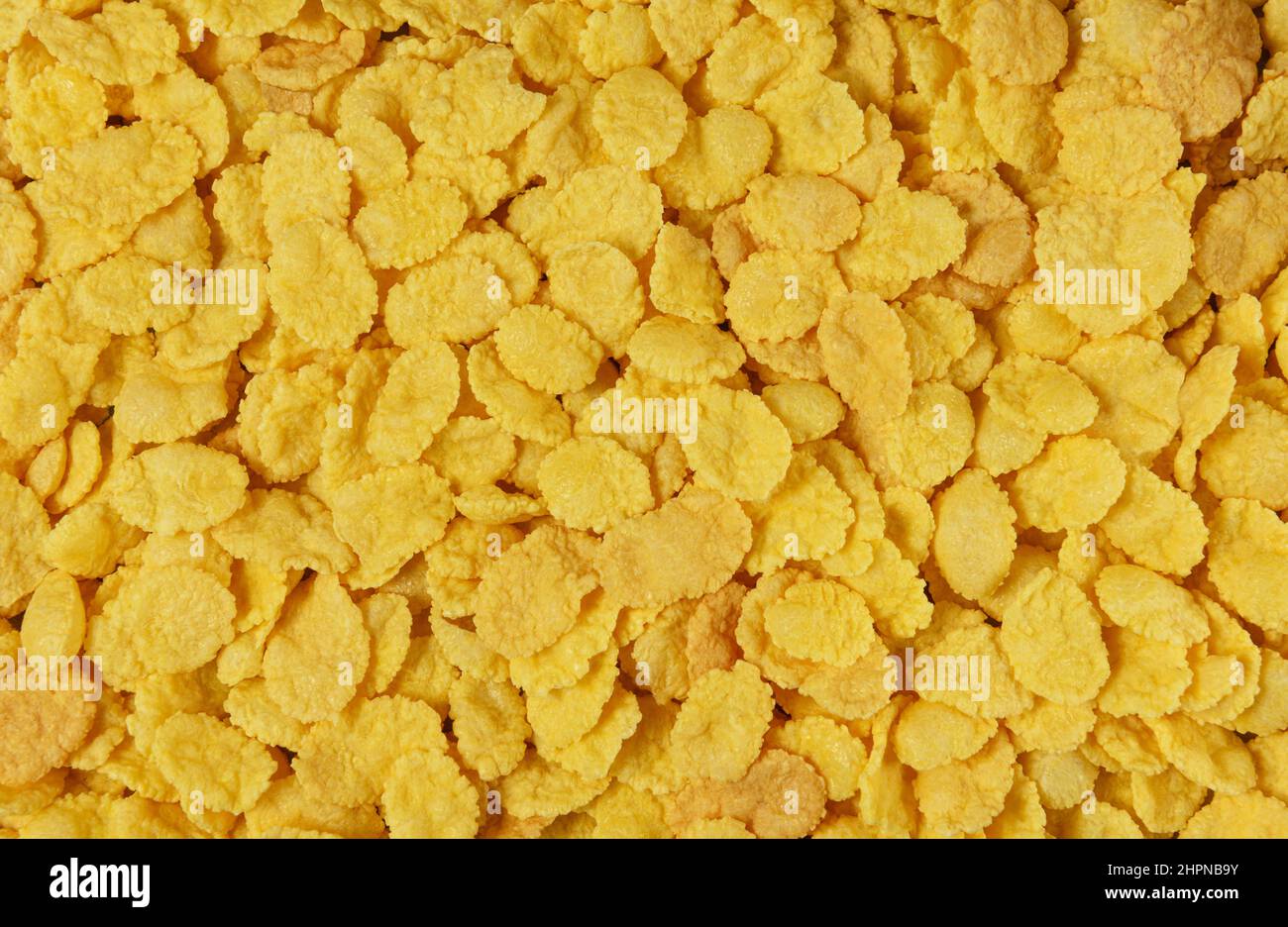 Corn flakes background. Close up top view Stock Photo - Alamy