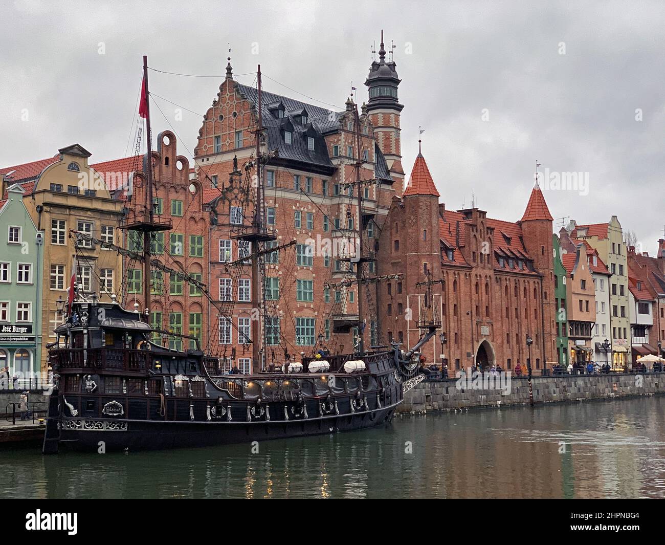 Dramatic picture of the historical buildings of Gdansk on the cold Nowa ...