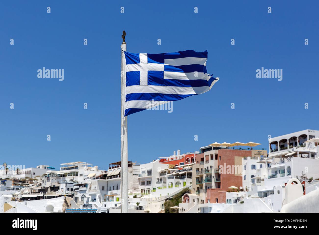 Greek flag waving against the blue sky and Greek architecture Stock ...