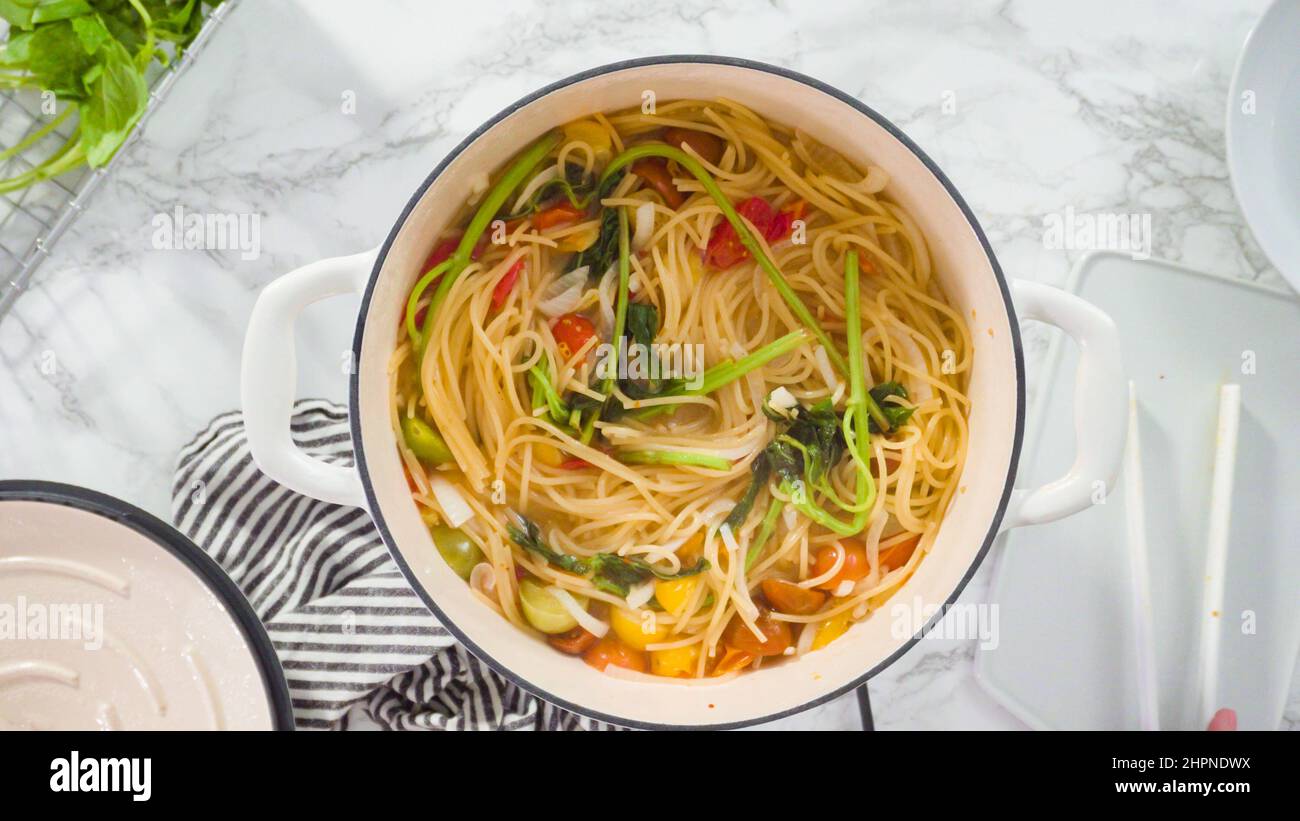 Flat lay. Step by step. Cooking on pot pasta recipe in an enameled cast ...