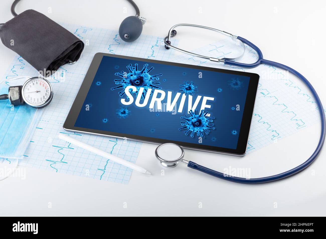 Tablet pc and doctor tools on white surface Stock Photo - Alamy