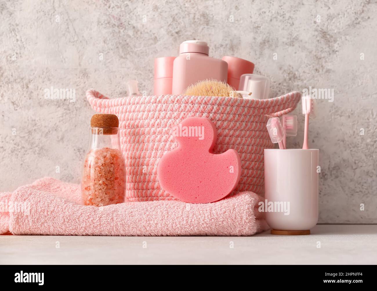 Set of different bath supplies and sponge on light background Stock ...