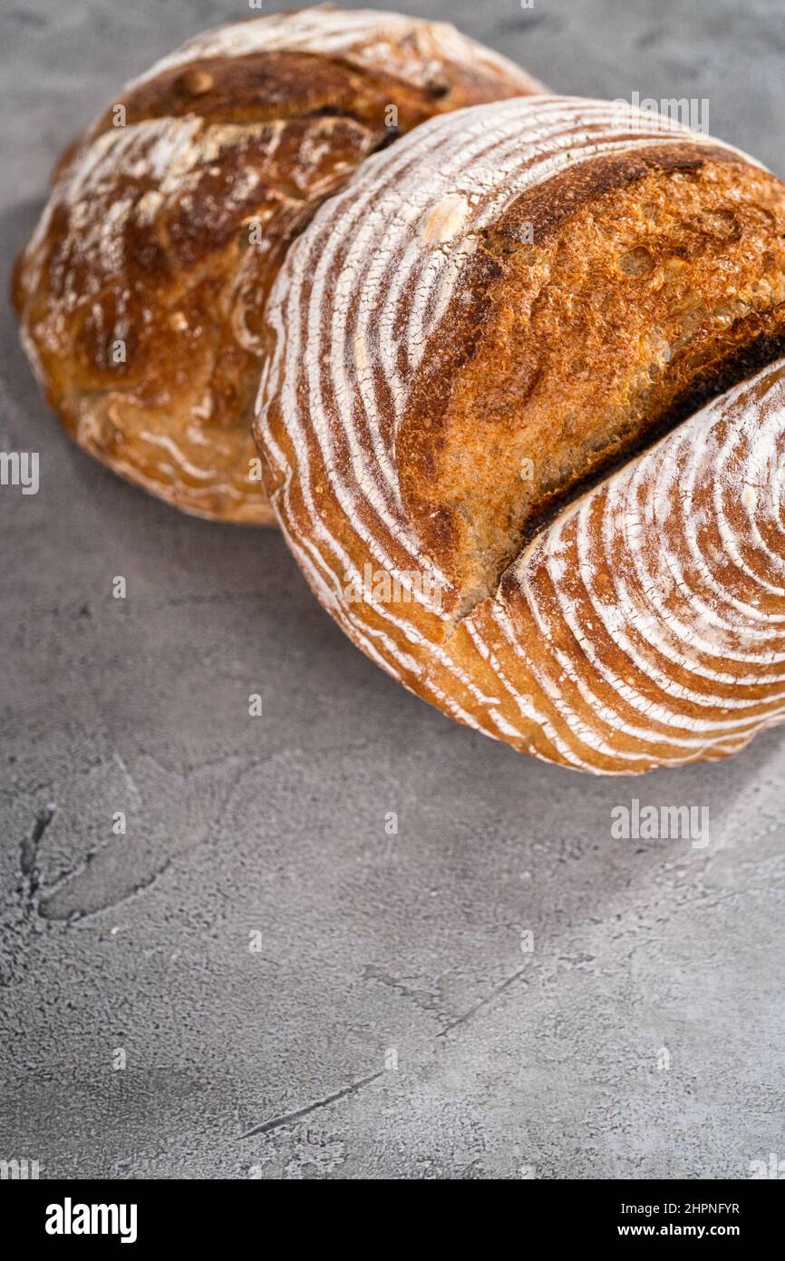 Freshly baked loaf of a wheat sourdough bread with marks from bread ...