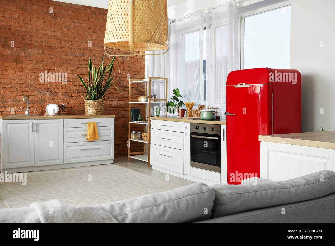 Interior of modern kitchen with red fridge and oven Stock Photo - Alamy