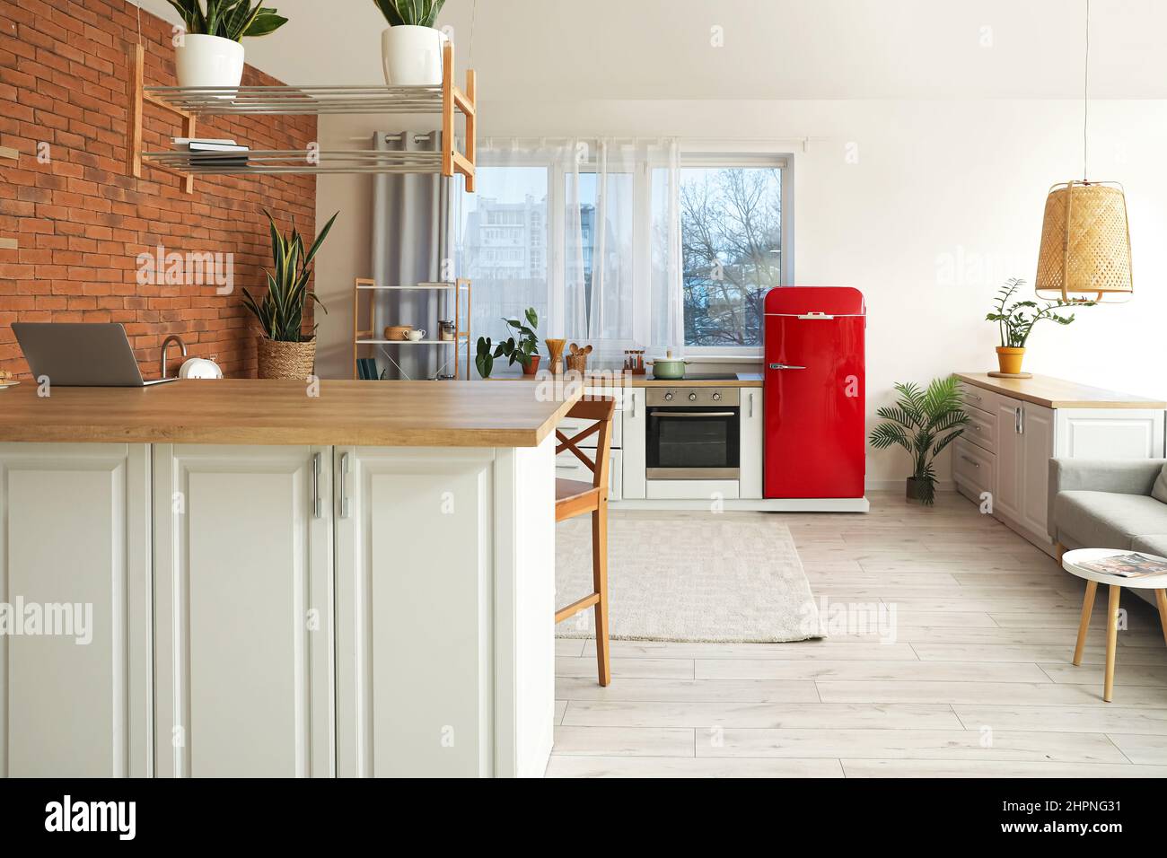 Interior of modern kitchen with red fridge and oven Stock Photo - Alamy