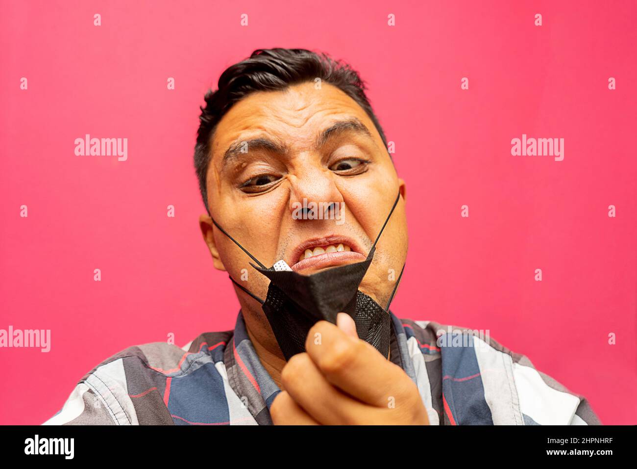 Ripping off mask hi-res stock photography and images - Alamy