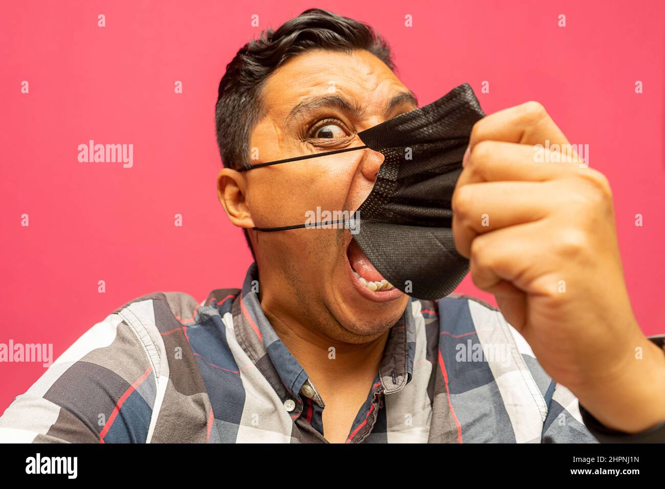 Ripping off mask hi-res stock photography and images - Alamy