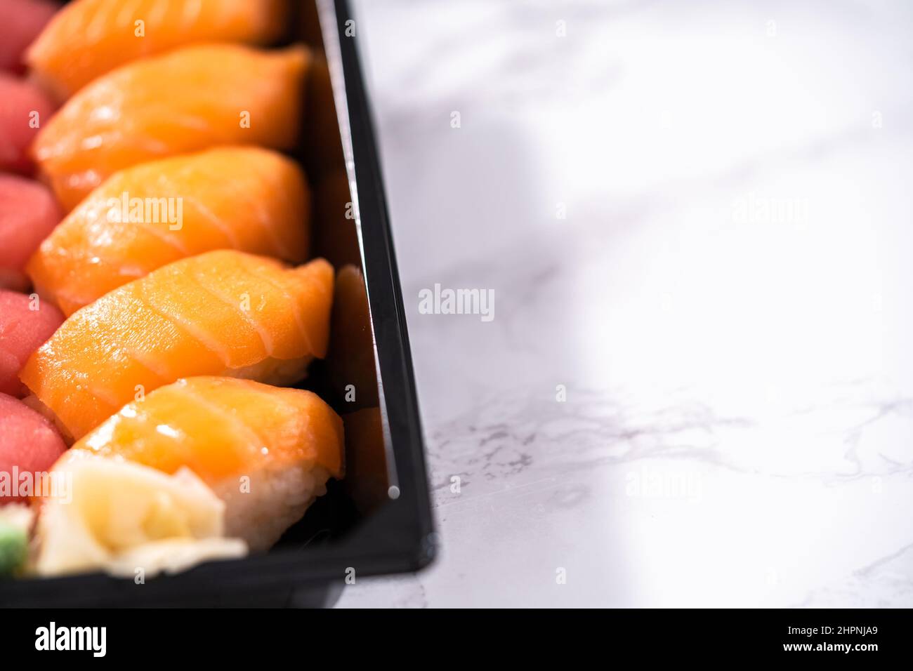 Pre-packaged sushi in a plastic tray Stock Photo - Alamy