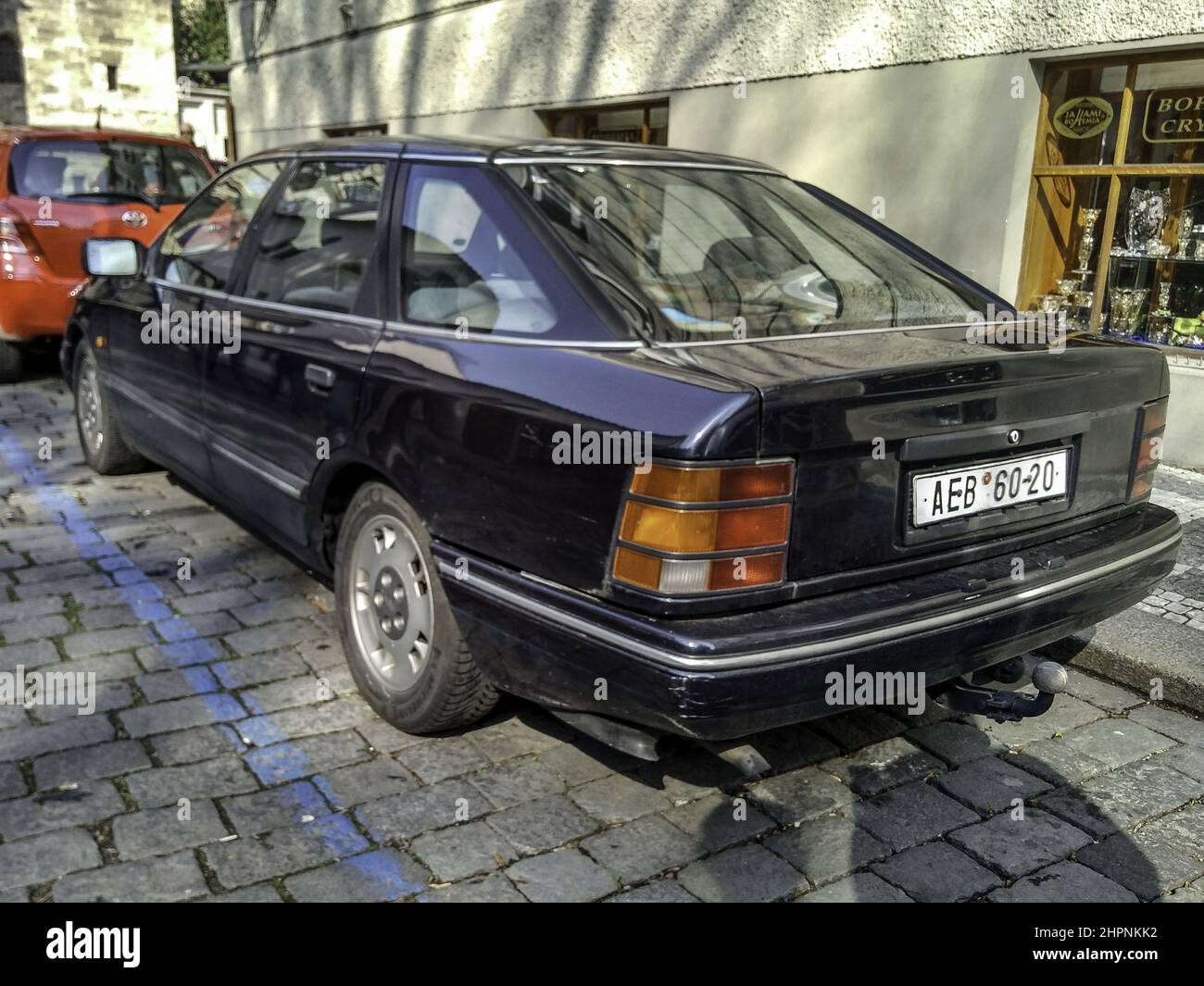 Old dark car Ford Scorpio of 90s parked in the street Stock Photo - Alamy