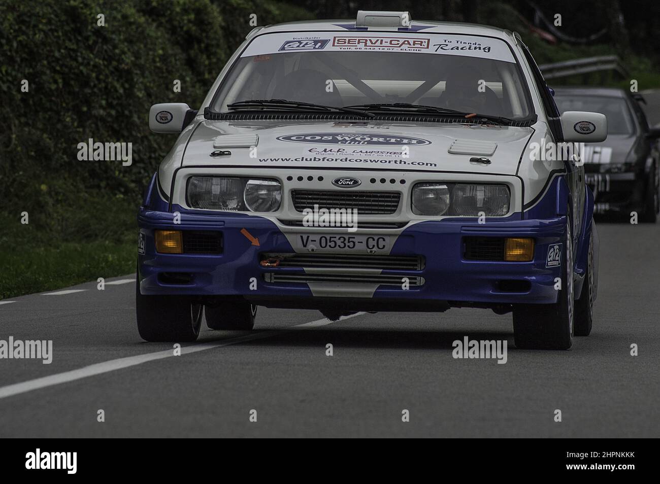 Sports white car running fast in the asphalt rally, Ford Sierra RS500 ...