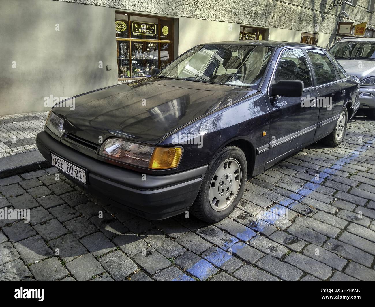 Old dark car Ford Scorpio of 90s parked in the special parking Stock ...
