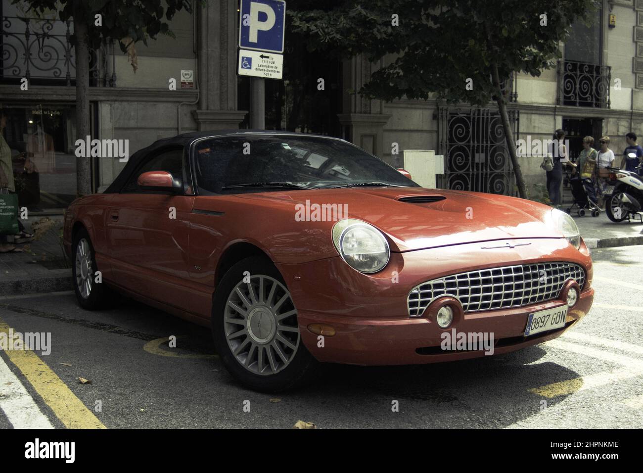 Pretty classic Ford Thunderbird red color parked in the street Stock ...
