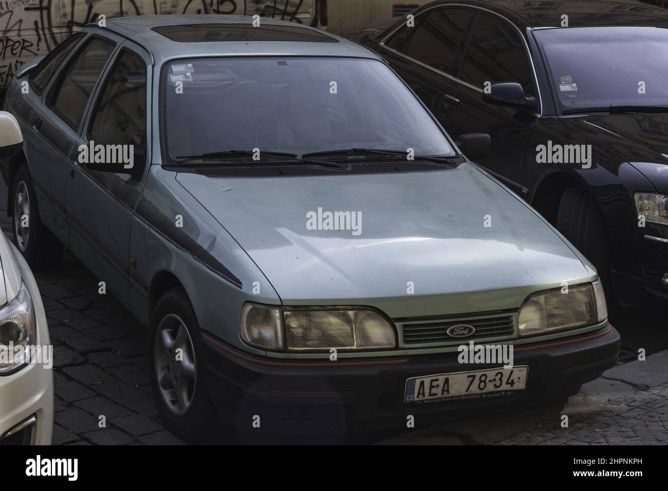 An old gray Ford Sierra classic street car Stock Photo - Alamy