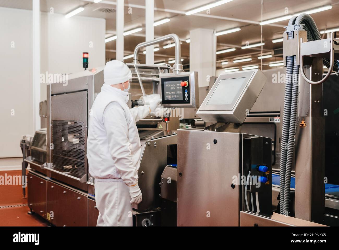 Automated production line with packaging and cutting of meat in modern ...