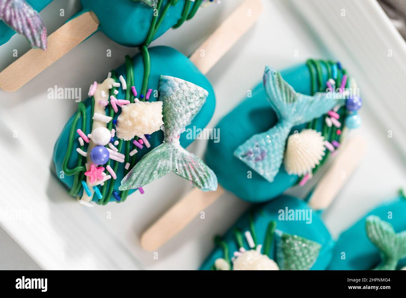 Mermaid cakesicles with drizzled chocolate, chocolate mermaid tails ...
