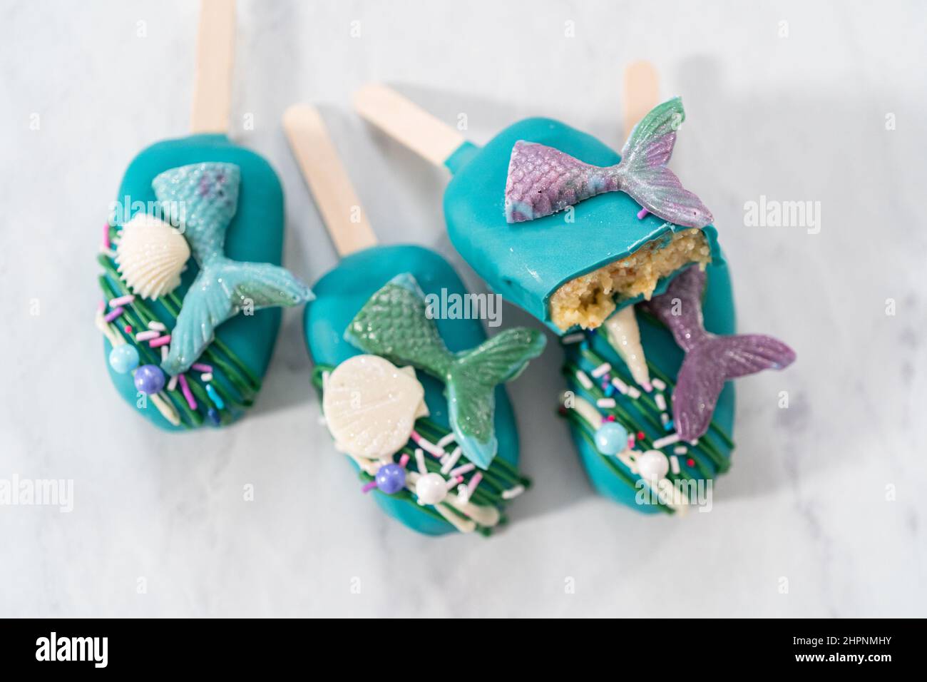 Sliced cakesicles with a chocolate mermaid tail Stock Photo - Alamy